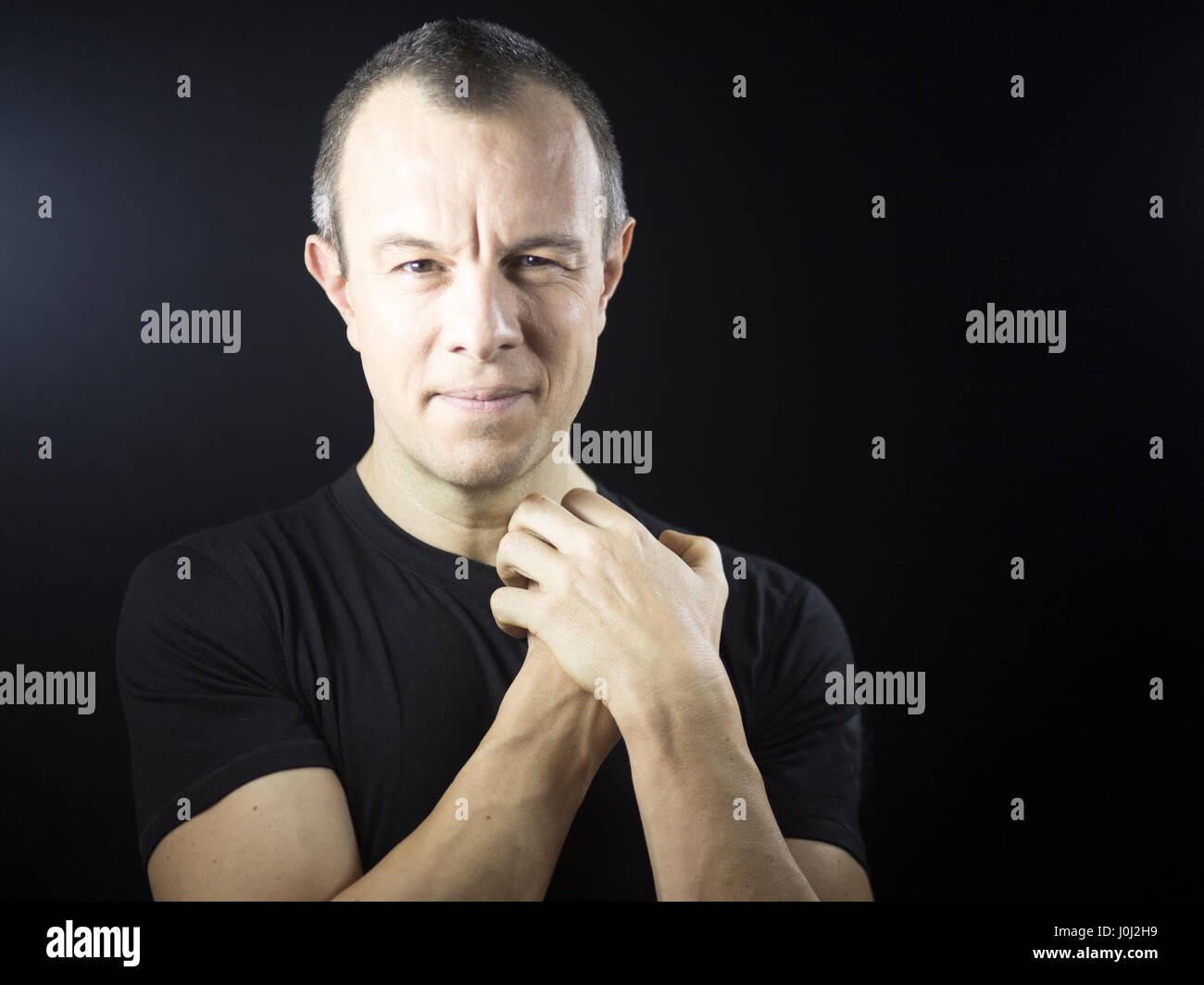 Attractive handsome slim healthy man aged in 40's in black t-shirt ...