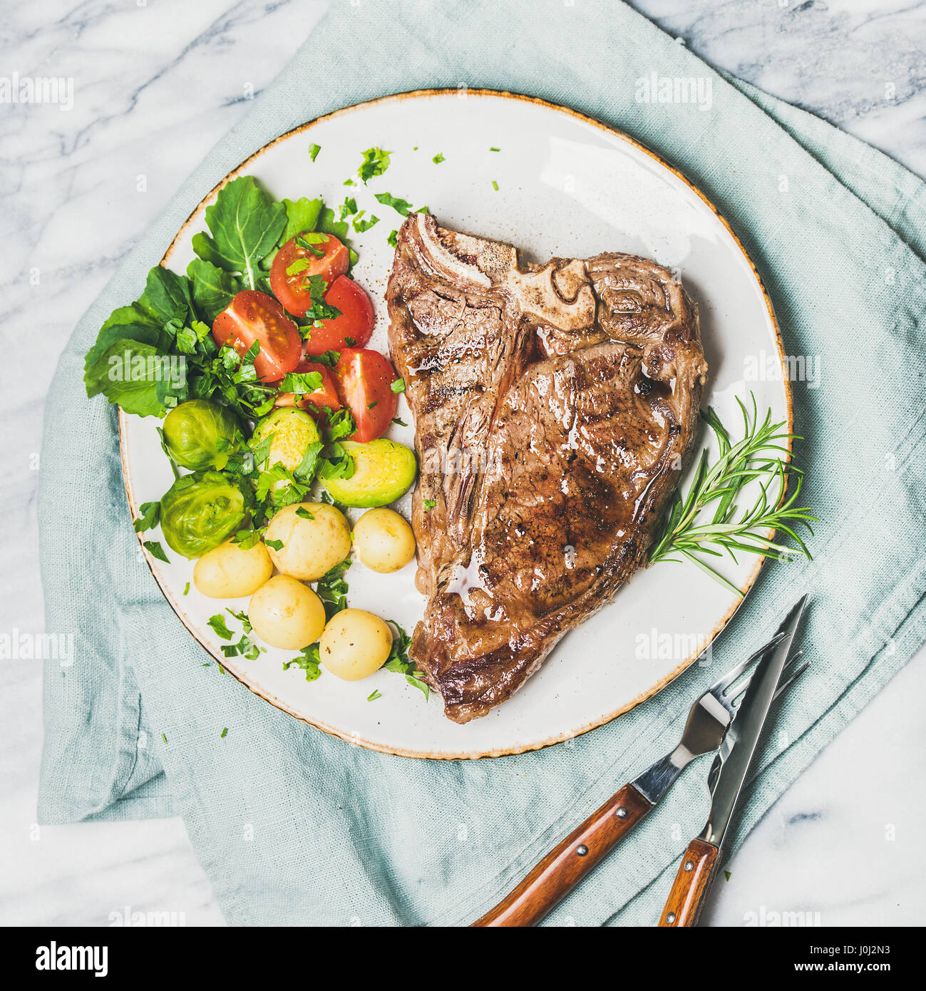 Meat dinner plate with cooked beef tbone steak, square crop Stock Photo ...