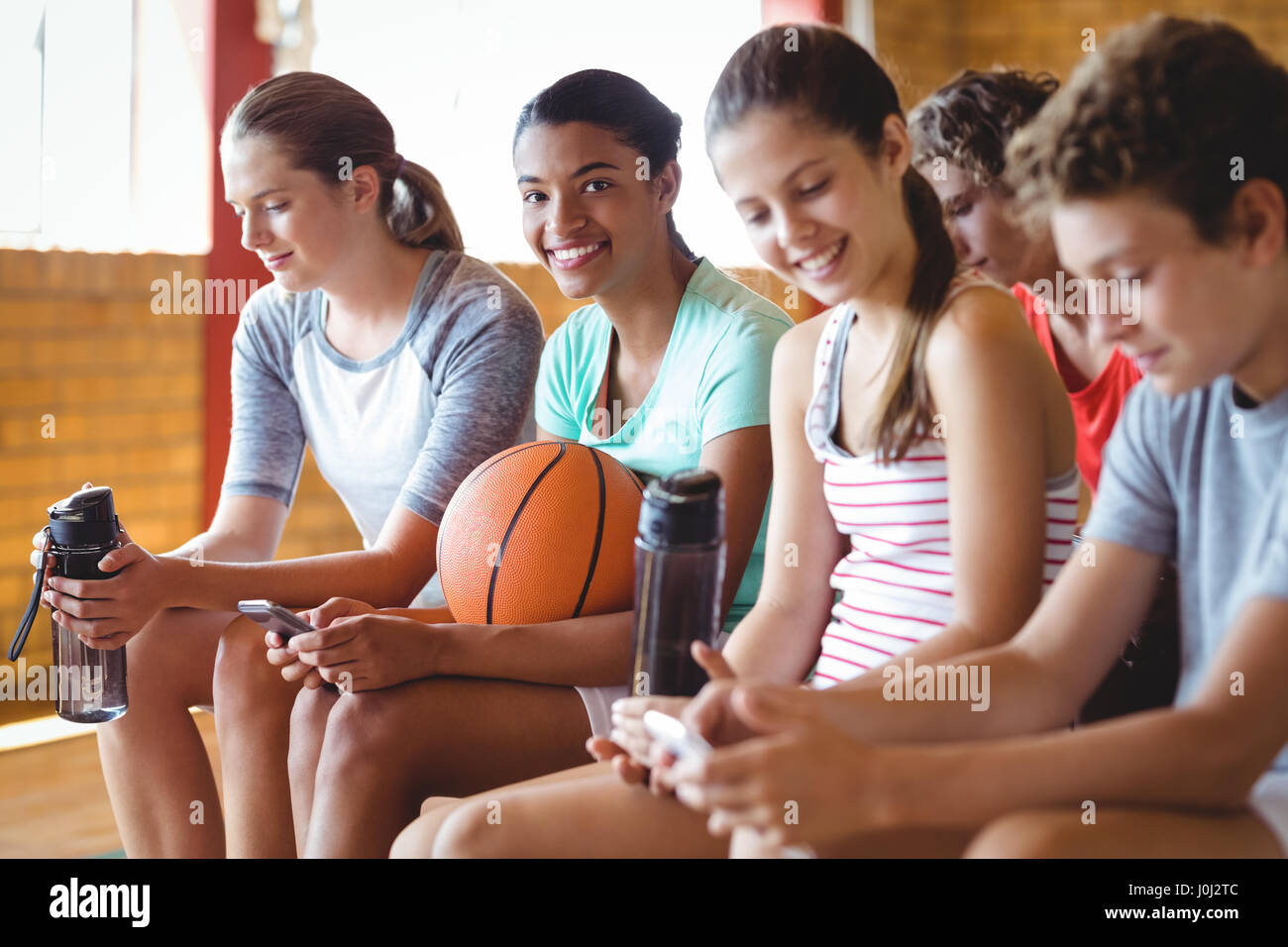 School kids using mobile phone hi-res stock photography and images - Alamy