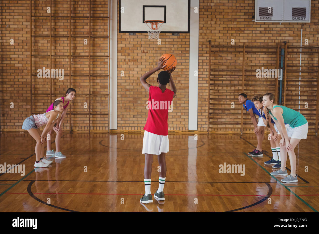 High school boy about to take a penalty shot while playing basketball ...