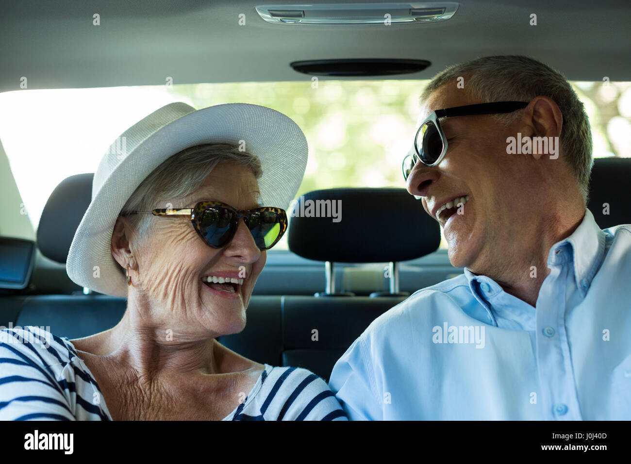 Cheerful senior couple enjoying in car Stock Photo - Alamy