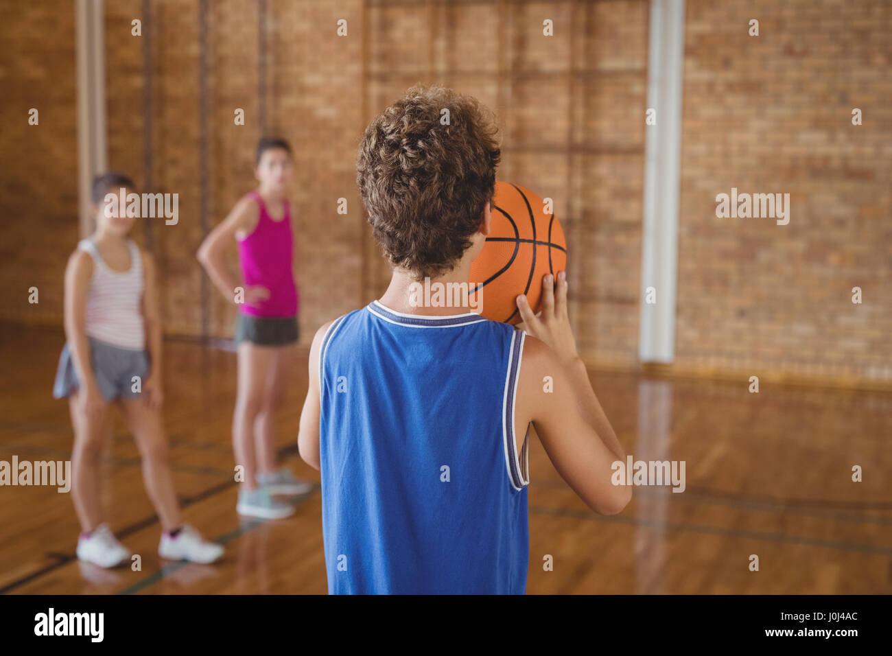 High school boy about to take a penalty shot while playing basketball ...
