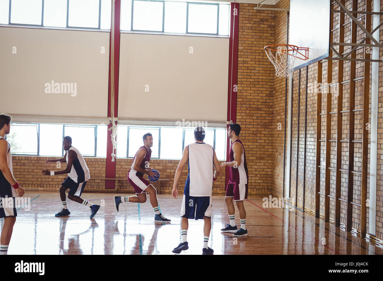 Male teammates practicing basketball hi-res stock photography and ...