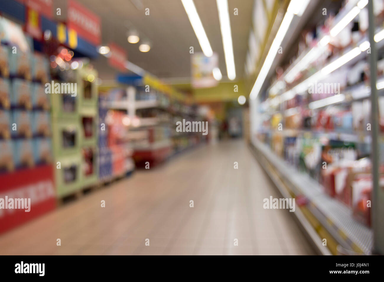 blurred background of local supermarket with goods on display Stock ...