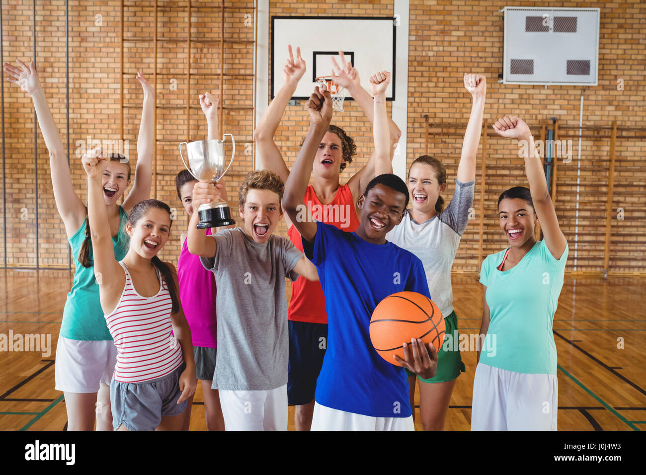 Boy holding trophy smiling hi-res stock photography and images - Alamy