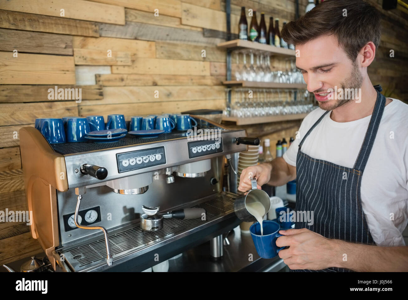 Waiter making coffee at counter in cafÃƒÂ© Stock Photo - Alamy