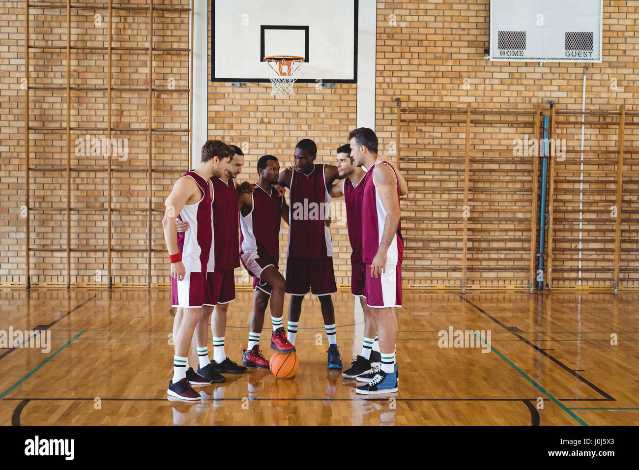 Basketball player interacting with each other in the court Stock Photo ...