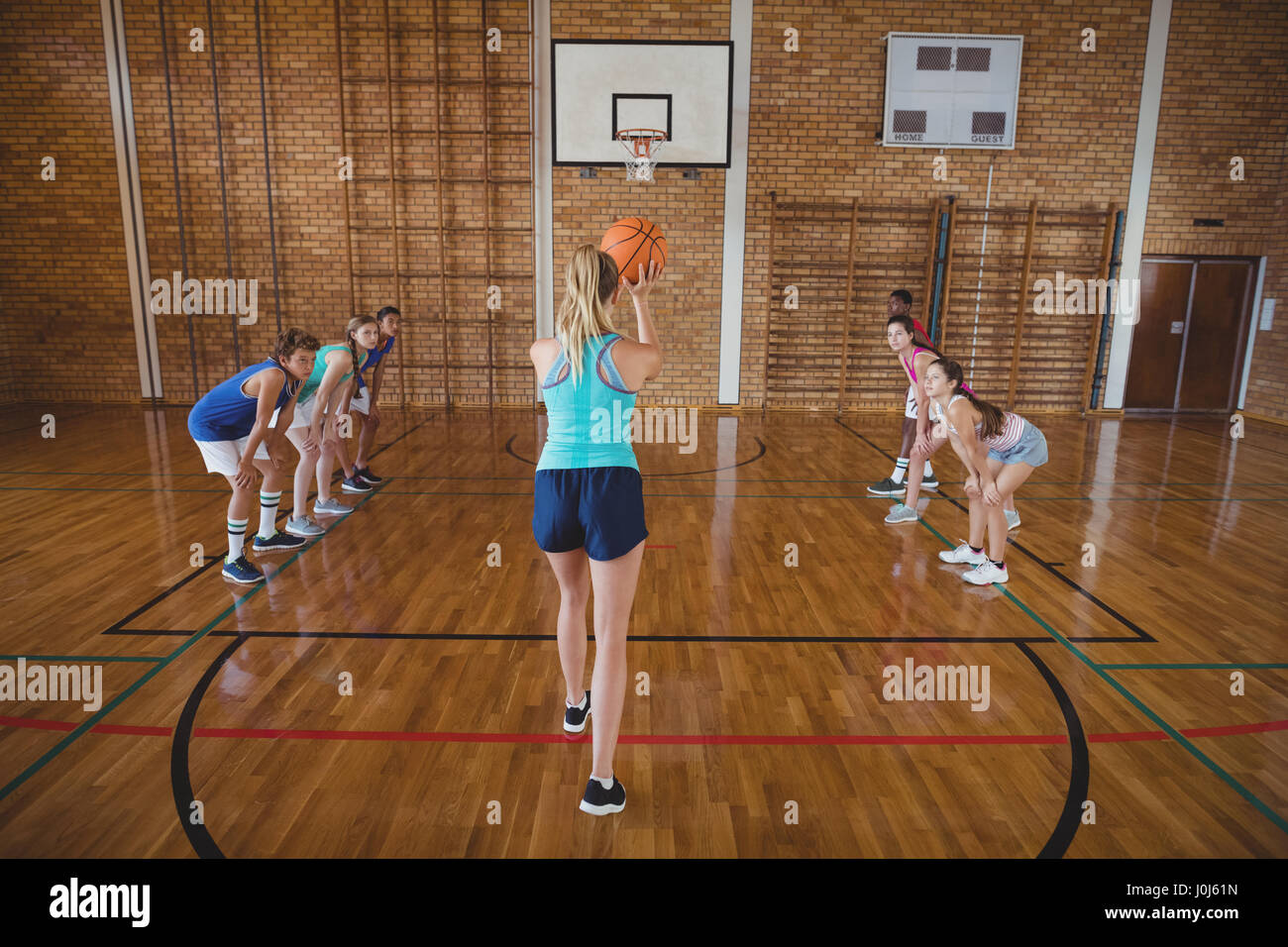 High school girl about to take a penalty shot while playing basketball ...