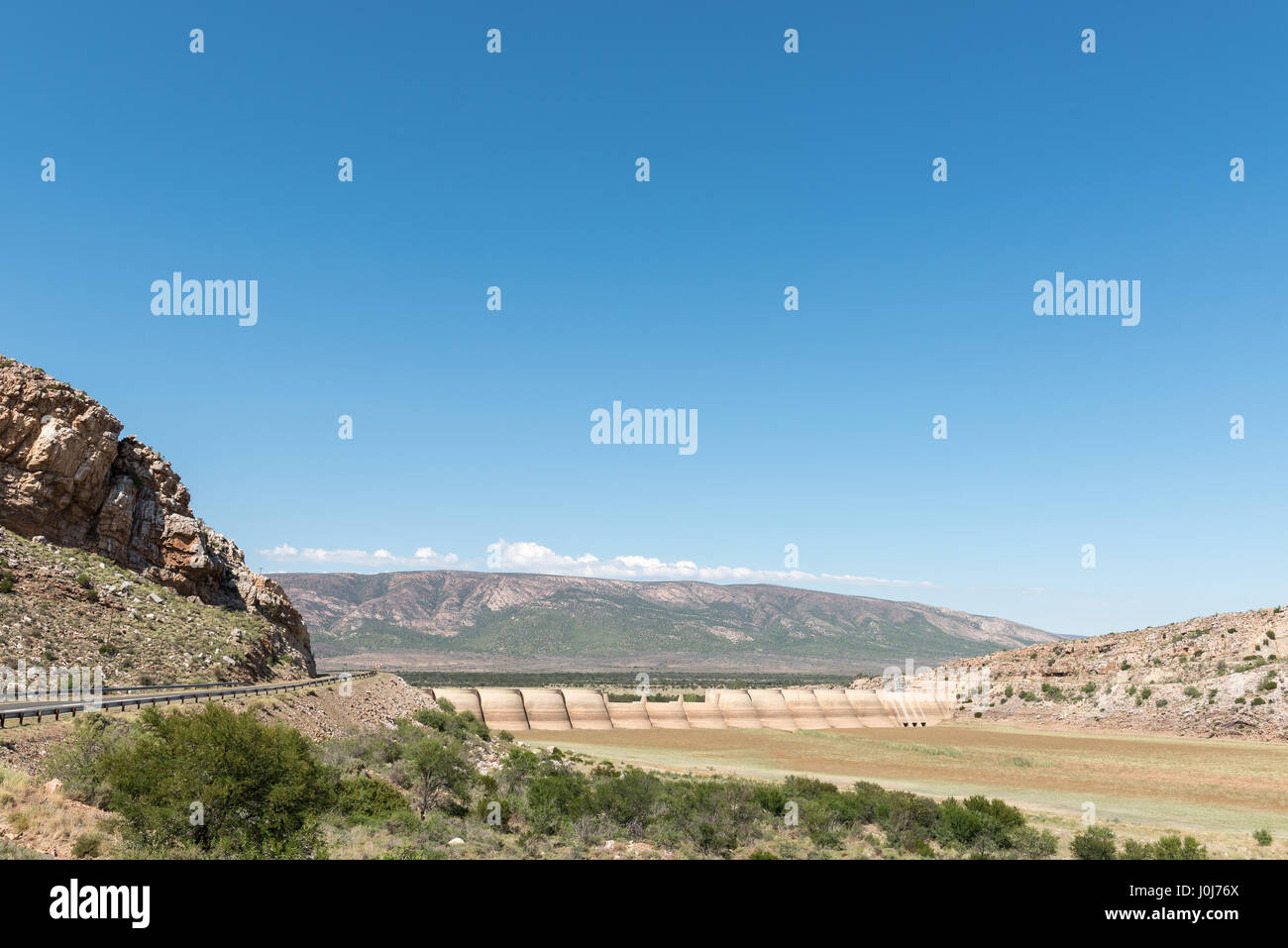 The N9 road skirting past the empty Beervlei dam near Willowmore in the ...