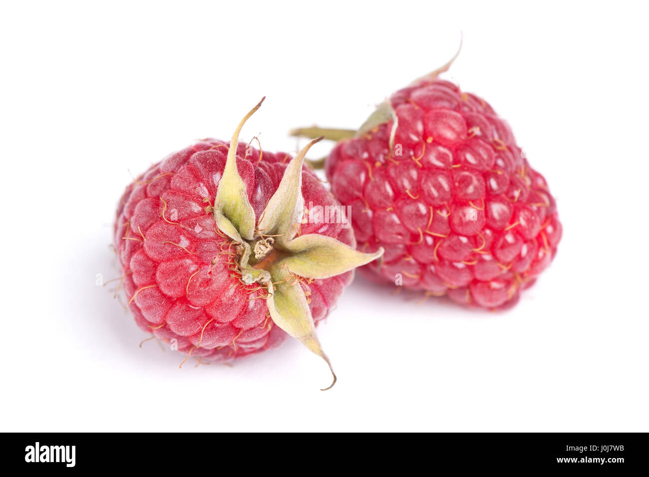 Few raspberries isolated on white background Stock Photo - Alamy