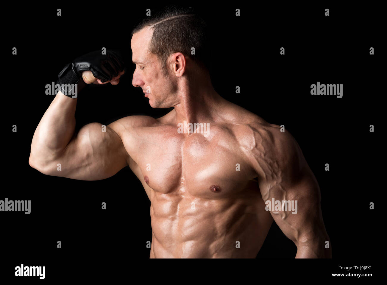 Strong Mixed Martial Arts fighter isolated in black Stock Photo - Alamy