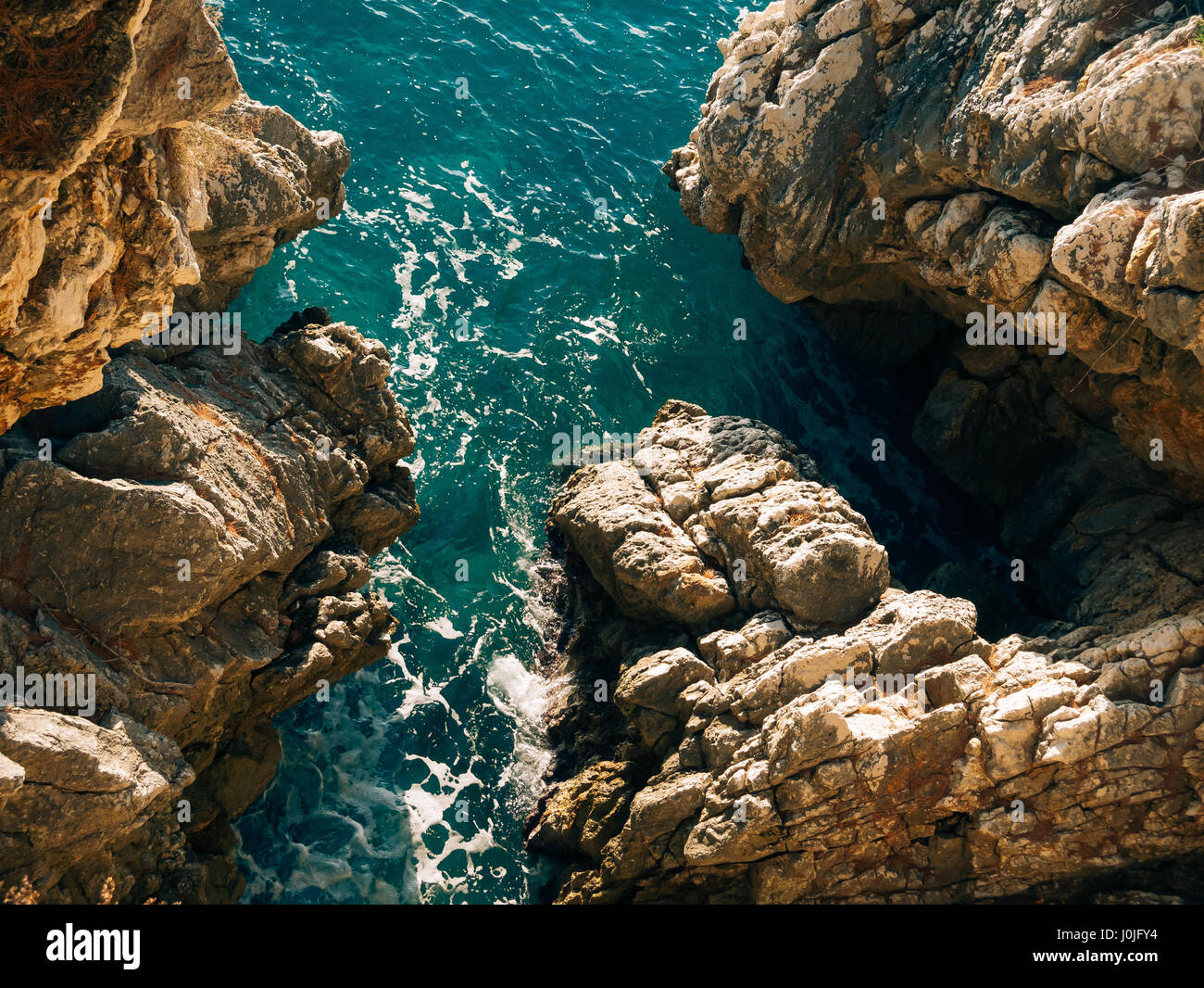 Rocks on the sea in Montenegro. Rocky coast. Wild beach. Dangerous ...
