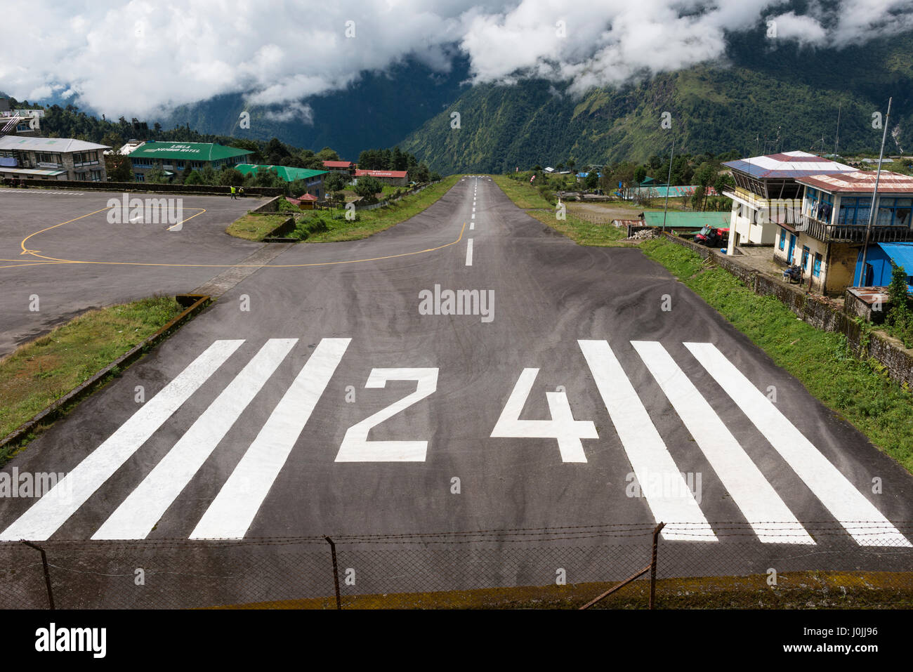 The sloped runway at Tenzing Hillary Airport, Lukla, Nepal. Photo ...