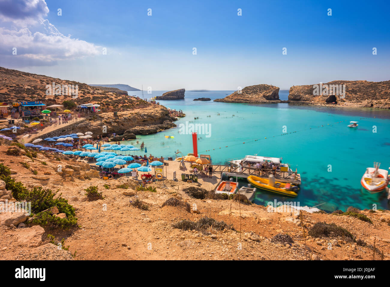 Comino, Malta - Tourists crowd at Blue Lagoon to enjoy the clear ...