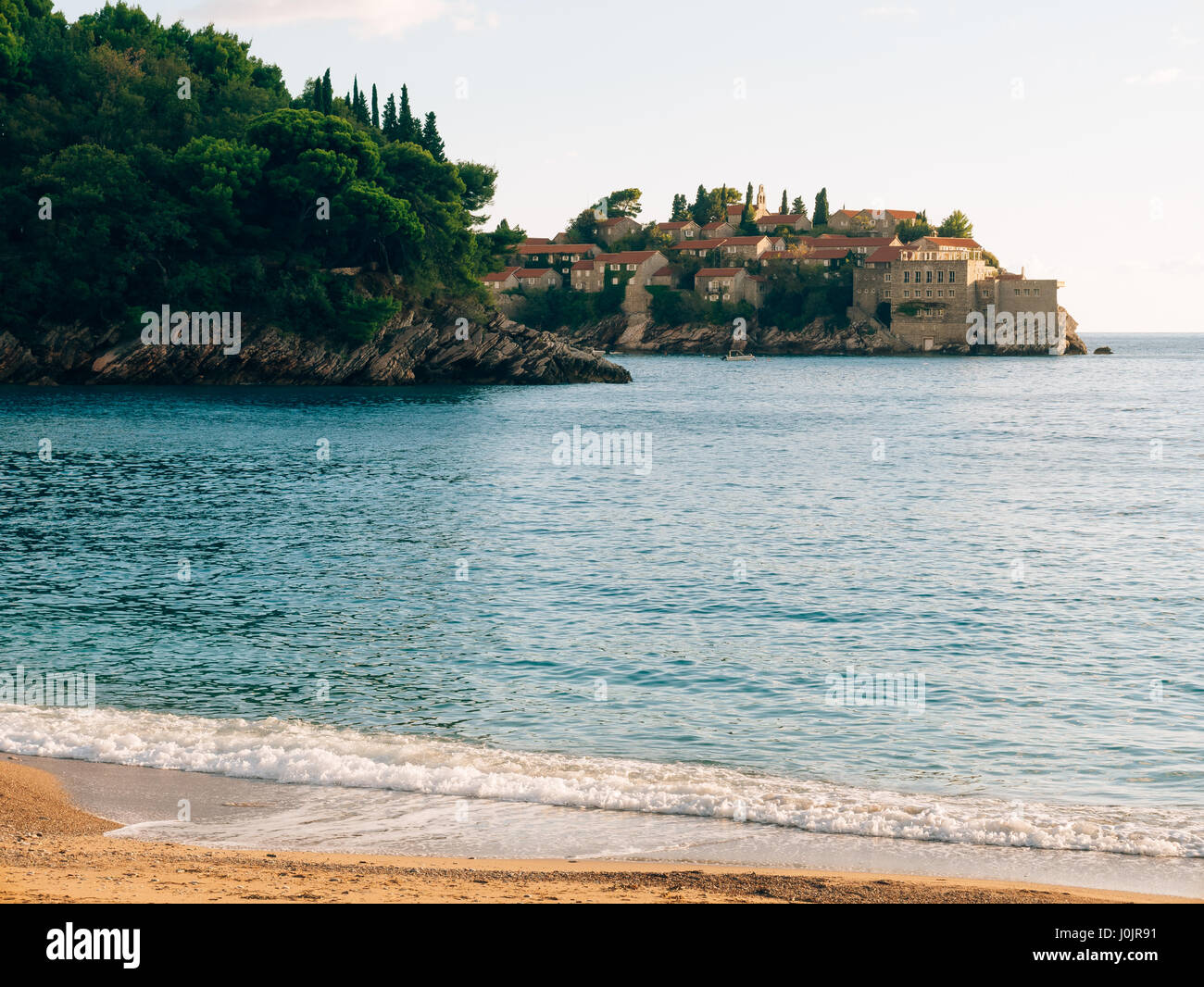 Island of Sveti Stefan close up at sunset. Montenegro, the Adriatic Sea ...