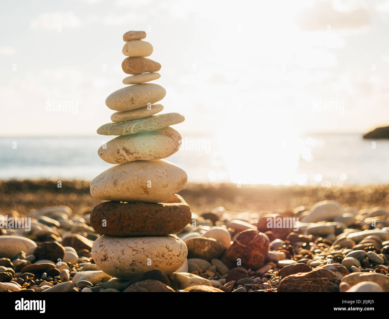 Balance stones on the beach. Peace of mind. Equilibrium life. Calming ...