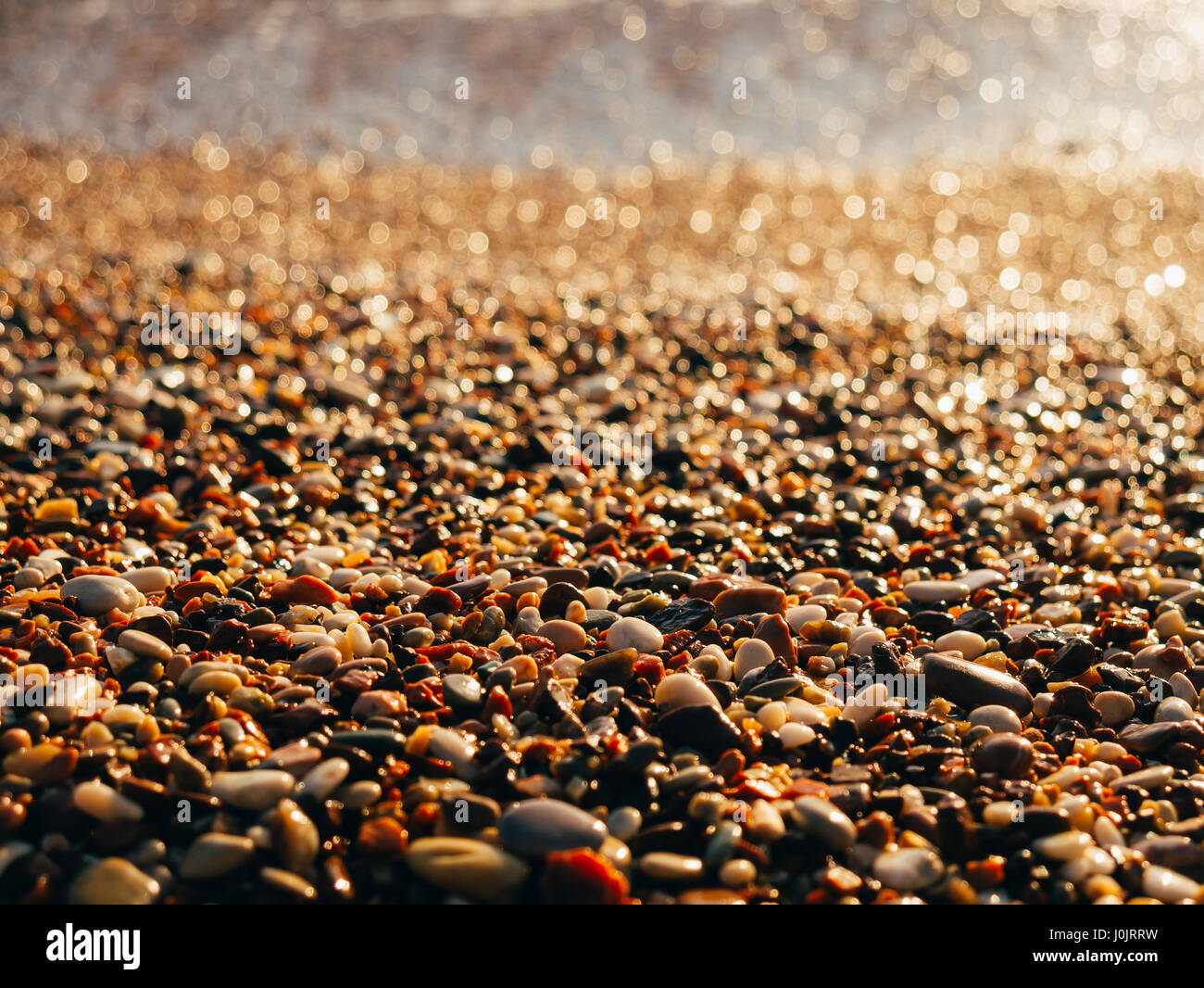 Pebbles on the beach. Texture of the sea shore. The Adriatic Sea in ...
