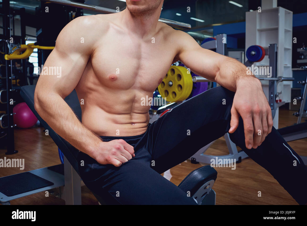 The athletic body of a man in gym Stock Photo - Alamy