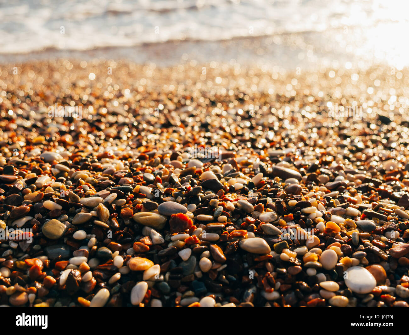 Pebbles on the beach. Texture of the sea shore. The Adriatic Sea in ...