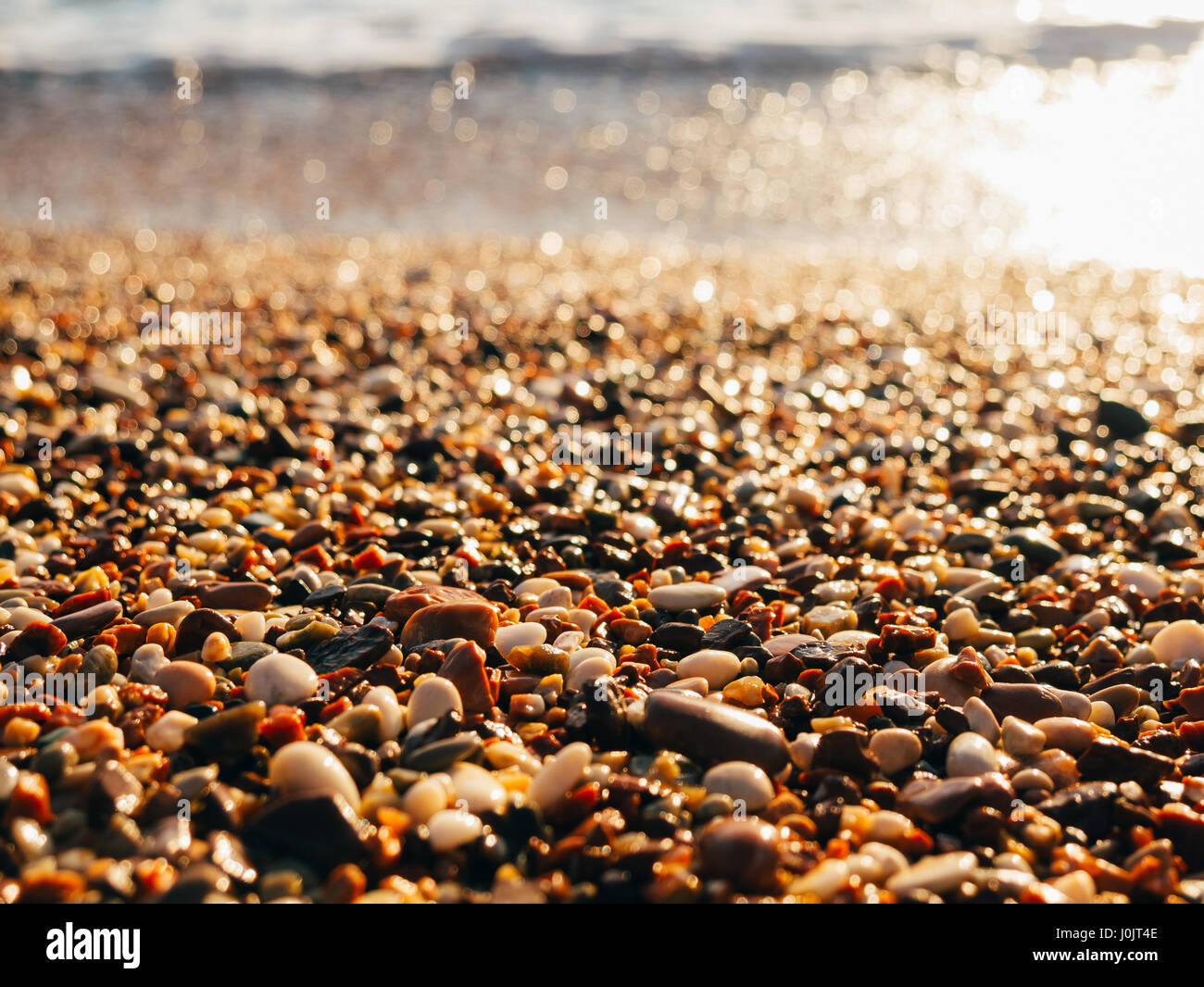 Pebbles on the beach. Texture of the sea shore. The Adriatic Sea in ...