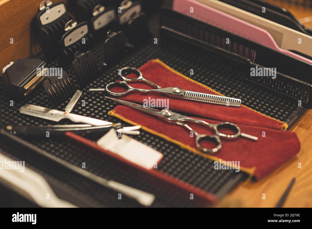 Professional scissors and combs lying on the table in barbershop Stock ...