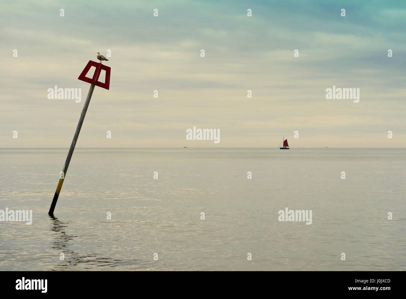 Still water morning at the beach Stock Photo - Alamy