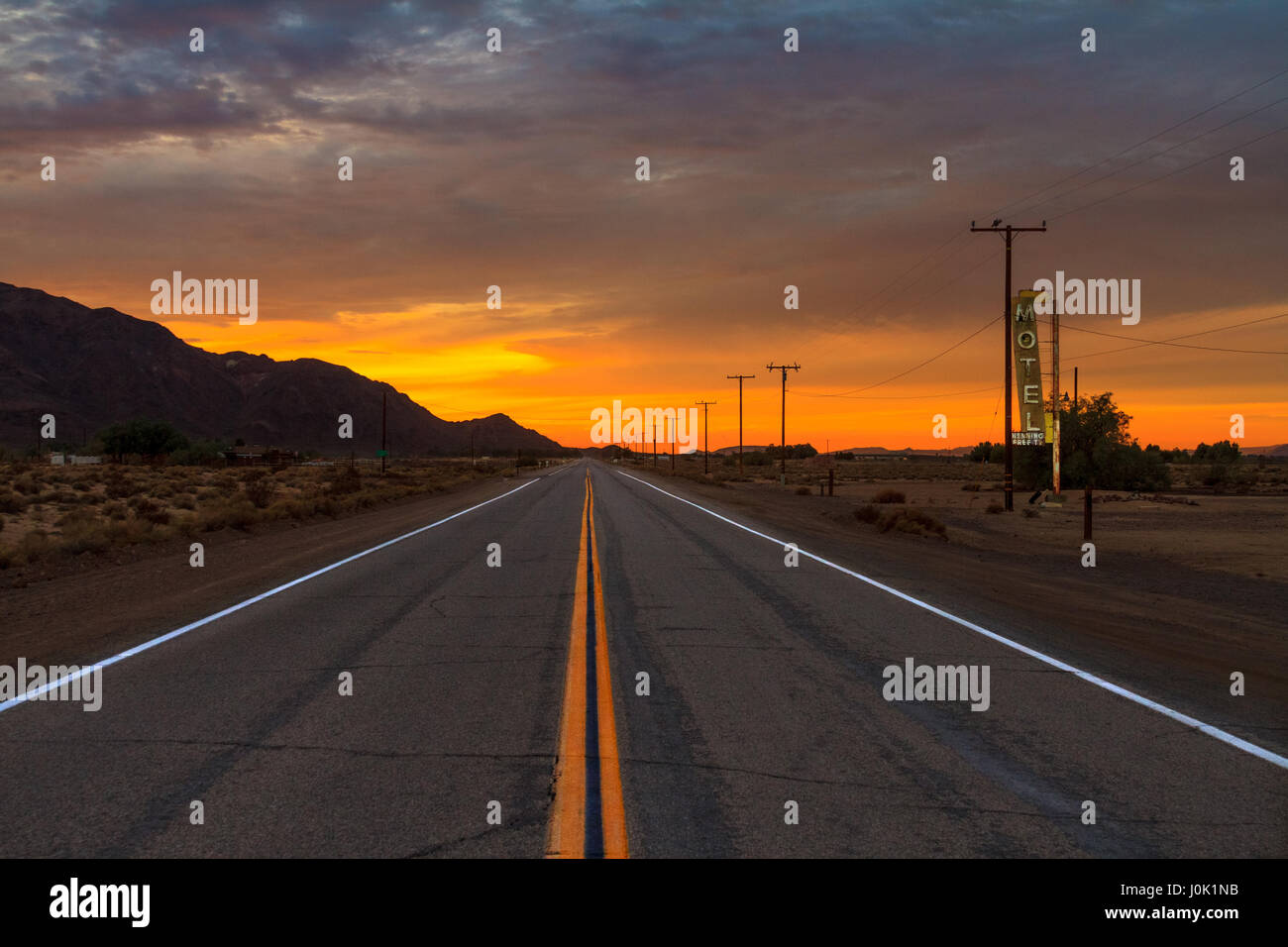 Desert road heading into the sunset in the Mojave Desert Stock Photo ...