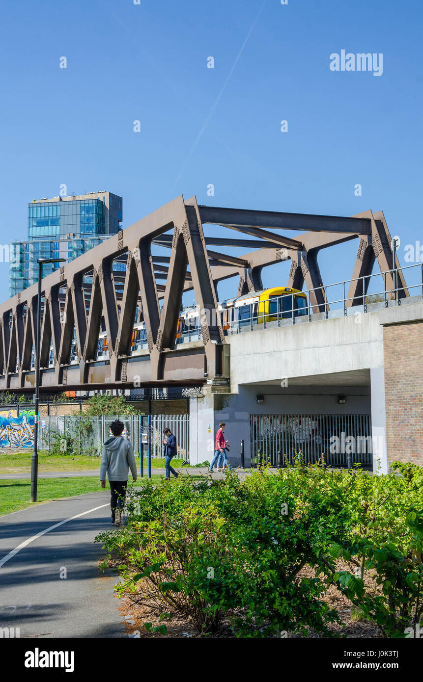 A train has just left Shoreditch High Street station and is seen from ...