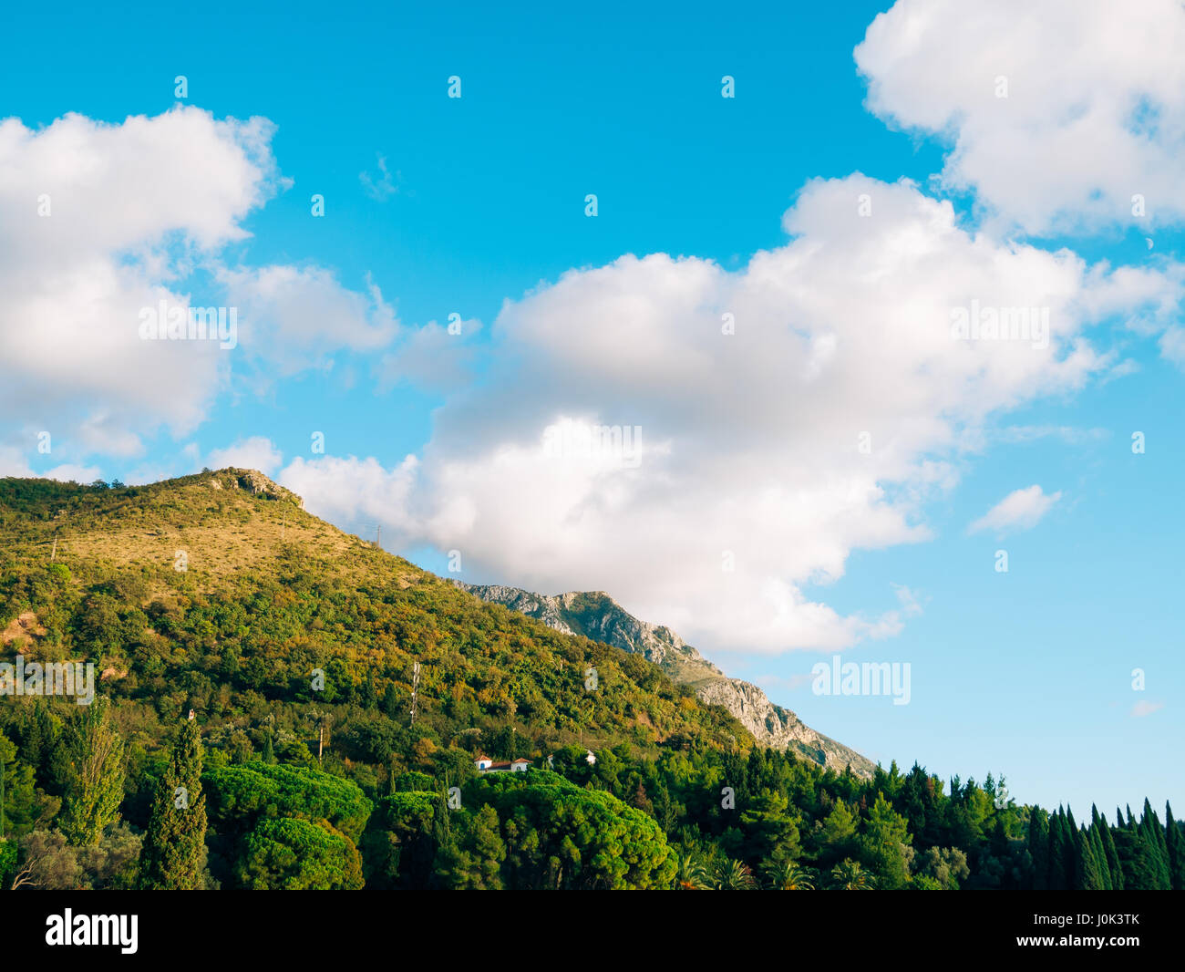 Mountain Komovi in Montenegro. Fog is falling on mountain as sun goes ...