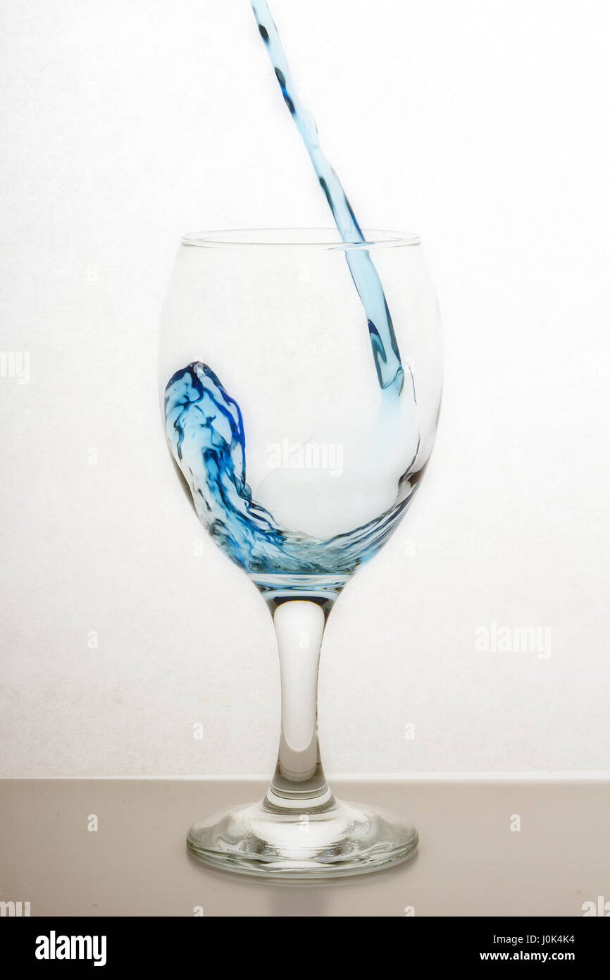 Blue drink liquid pour Stock Photo - Alamy