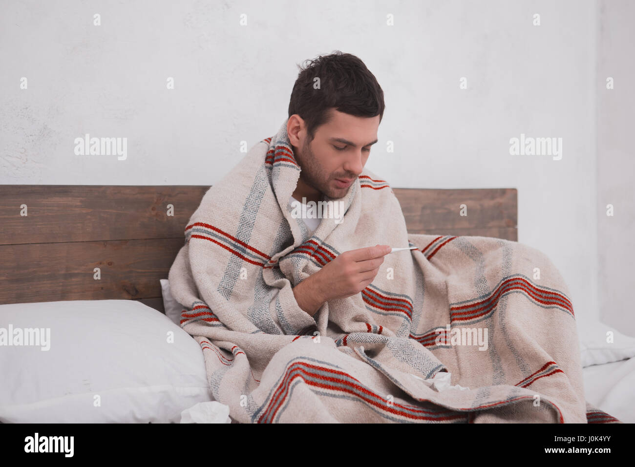 Sick young man fever concept Stock Photo - Alamy