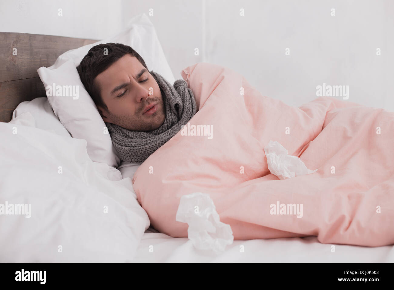 Sick young man fever concept Stock Photo - Alamy