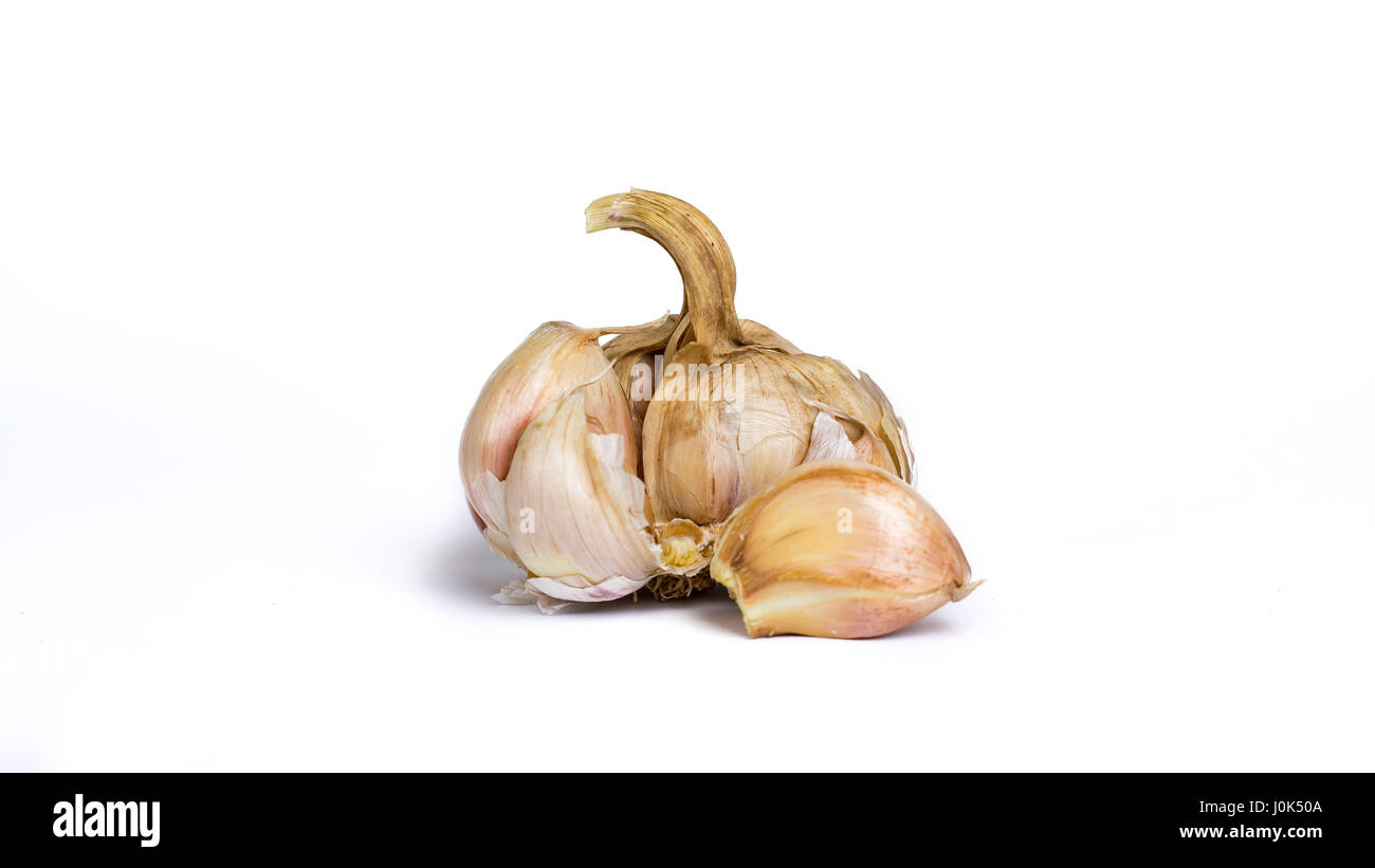 Organic garlic in front of white background Stock Photo - Alamy