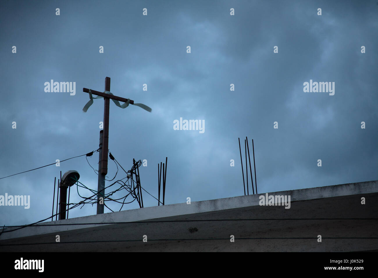 silhouette of cross at night with storm clouds Stock Photo - Alamy