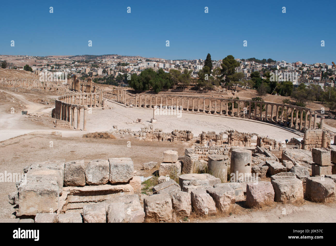 Skyline of modern Jerash with the Oval Plaza, main square of the ...