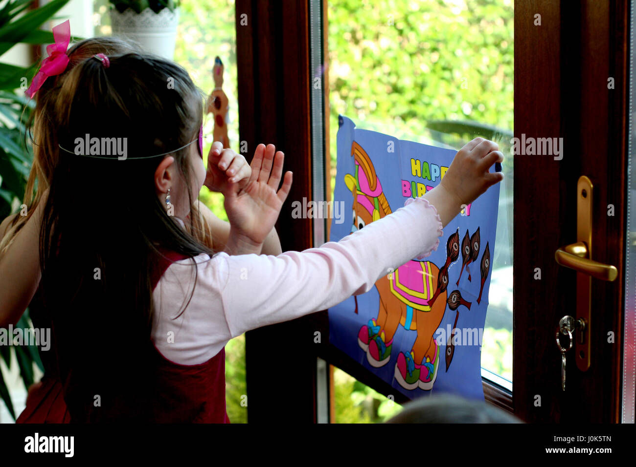 Kids Playing Pin The Tail On The Donkey
