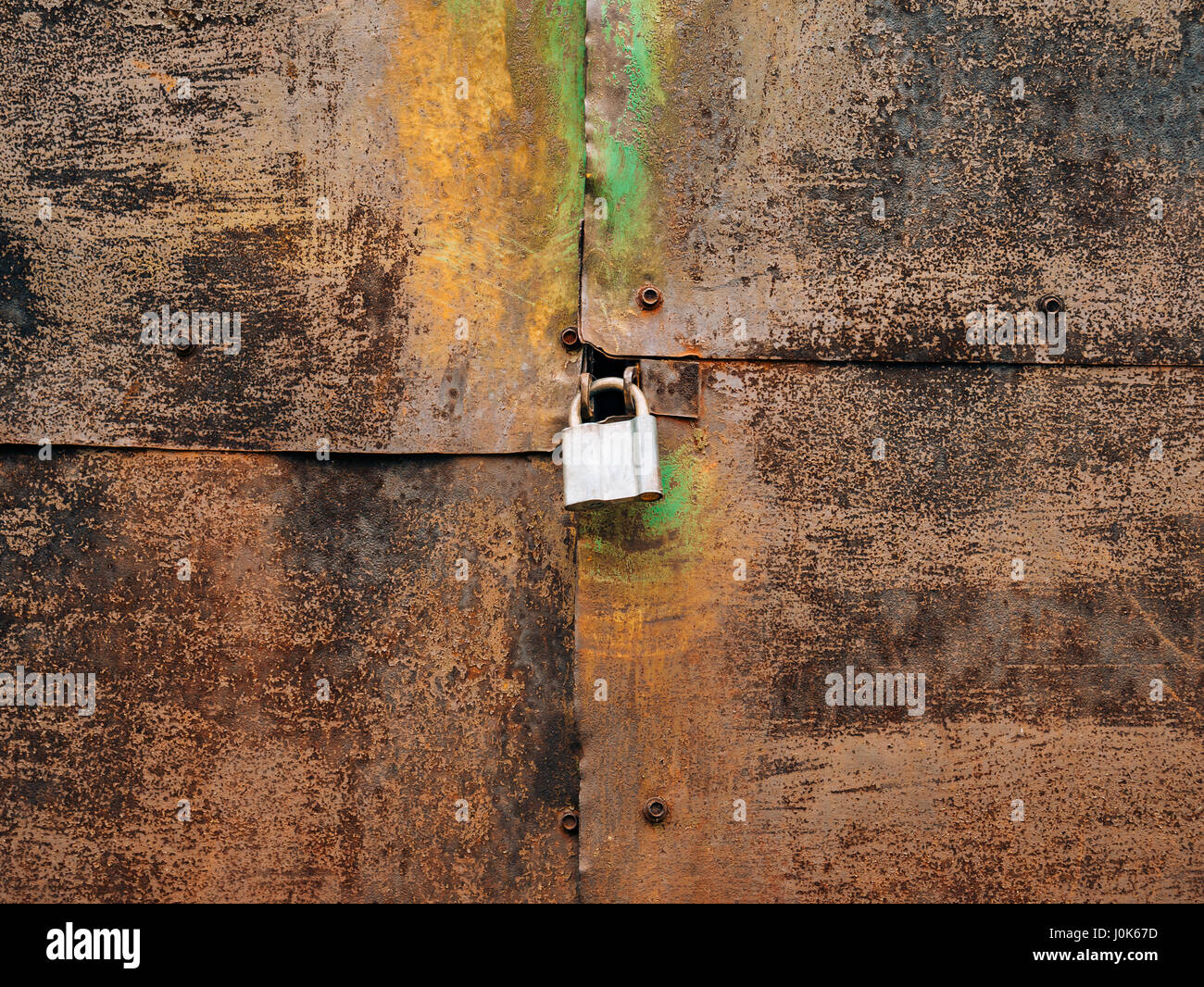 Metal rusty gate and padlock. Texture of rusty metal Stock Photo - Alamy