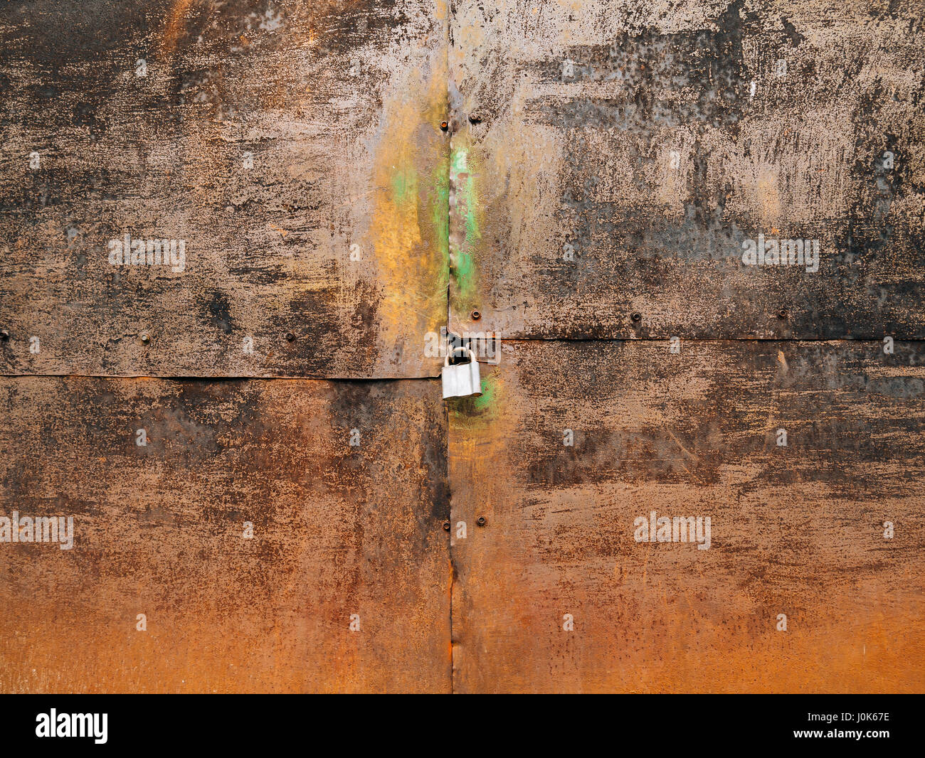 Metal rusty gate and padlock. Texture of rusty metal Stock Photo - Alamy