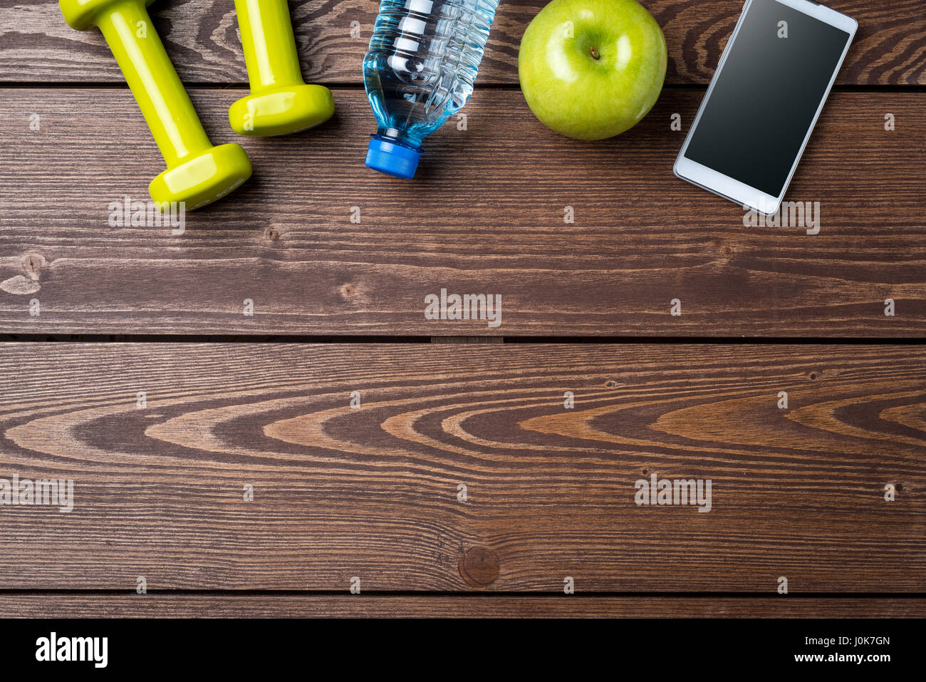 Fitness background with sport equipment on wooden floor Stock Photo - Alamy