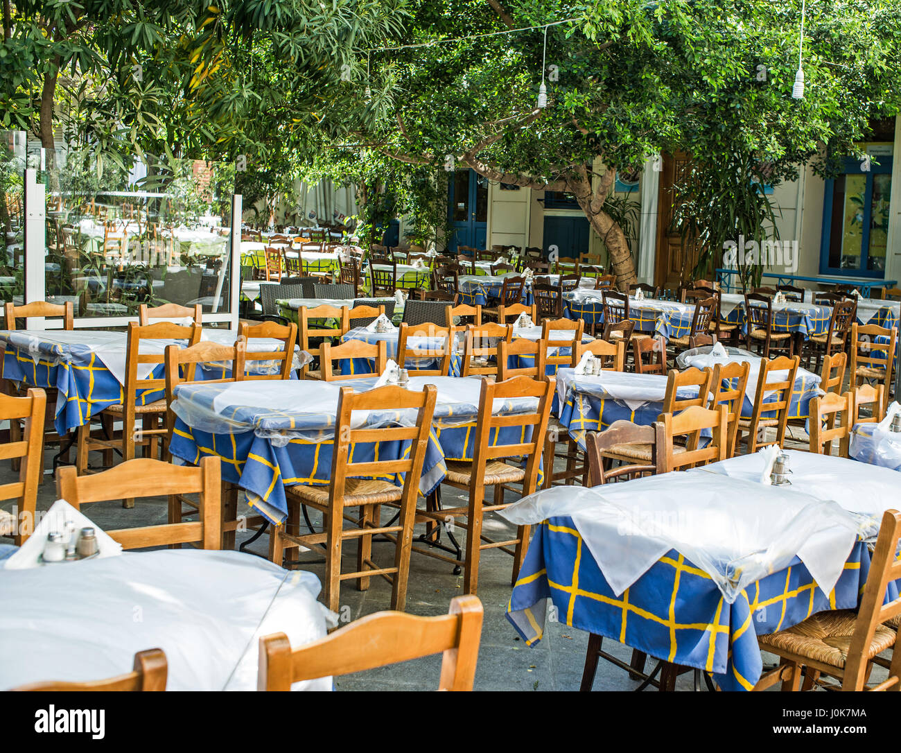 traditional greek outdoor restaurant. empty tables Stock Photo - Alamy