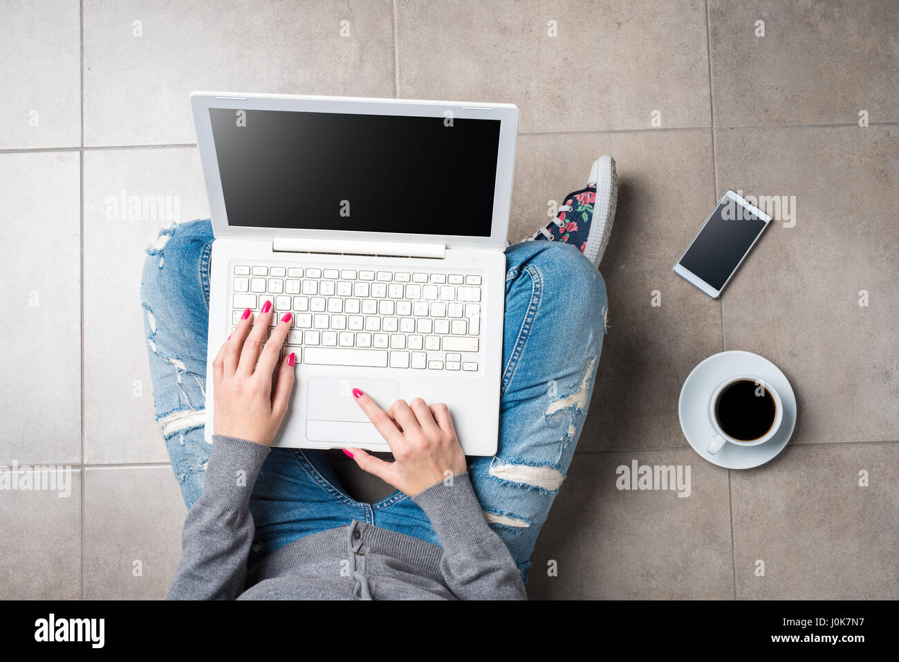Girl with computer on floor hi-res stock photography and images - Alamy