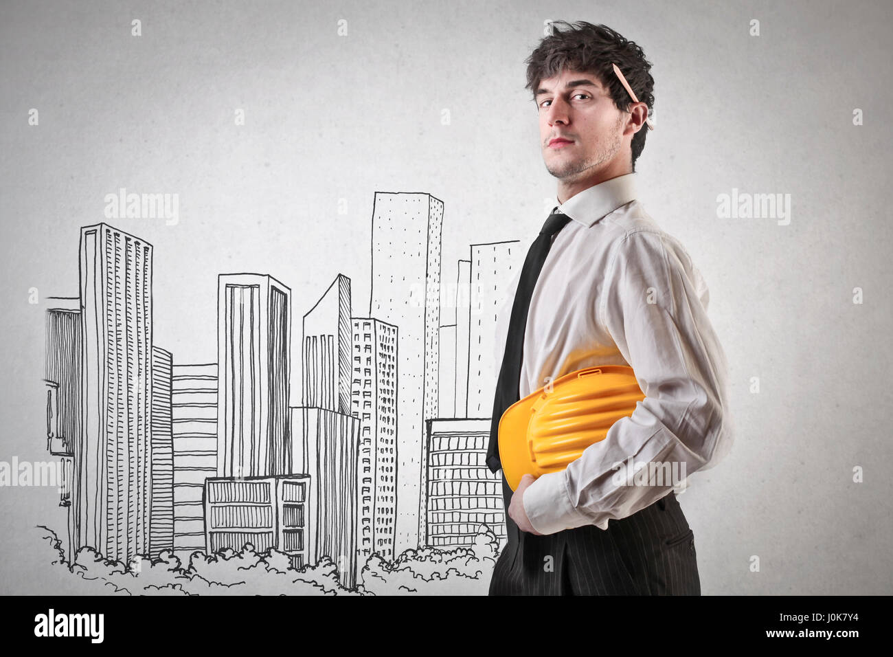 Architect man with his design Stock Photo - Alamy