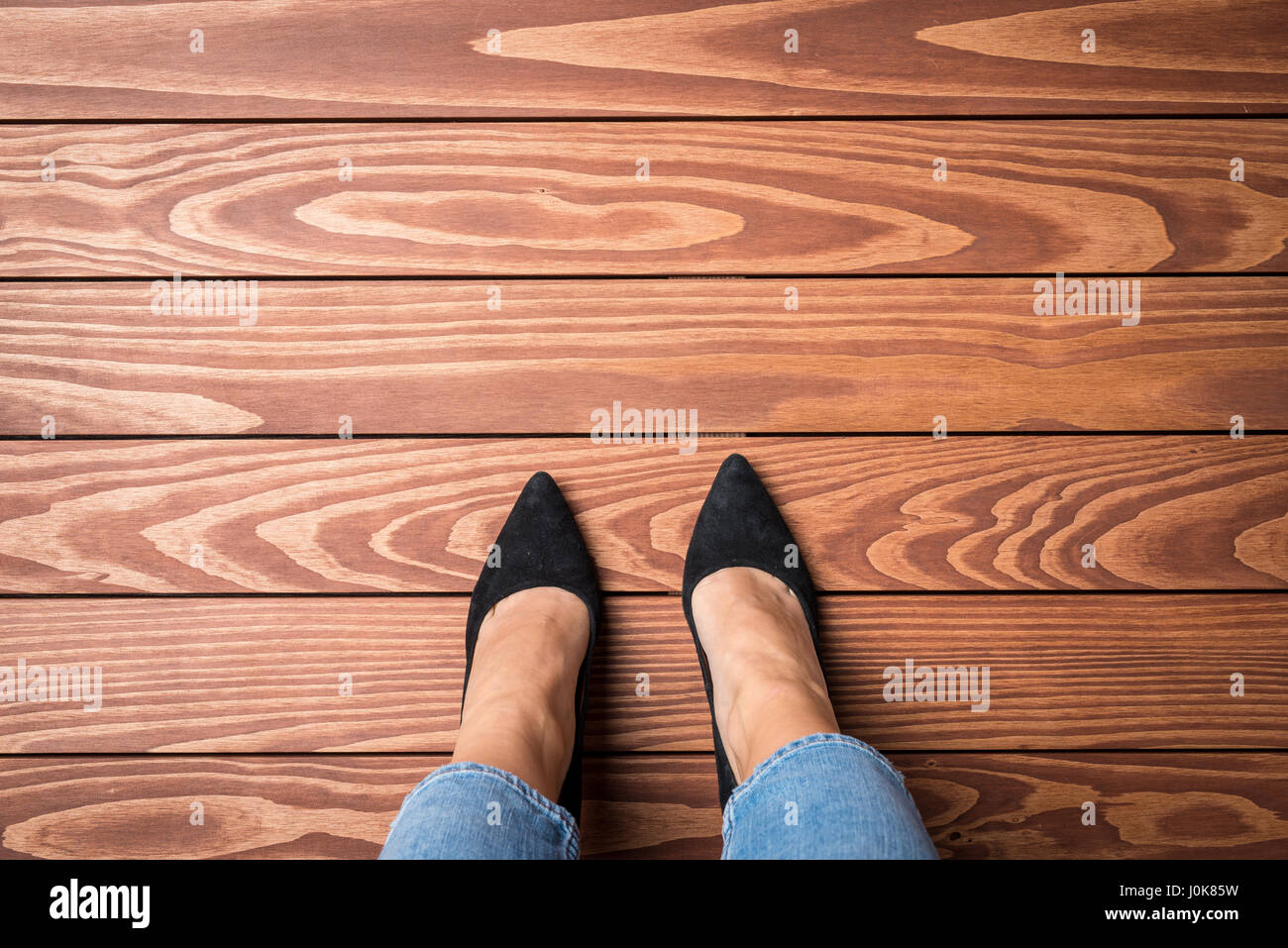 Woman walking on wooden floor hi-res stock photography and images - Alamy