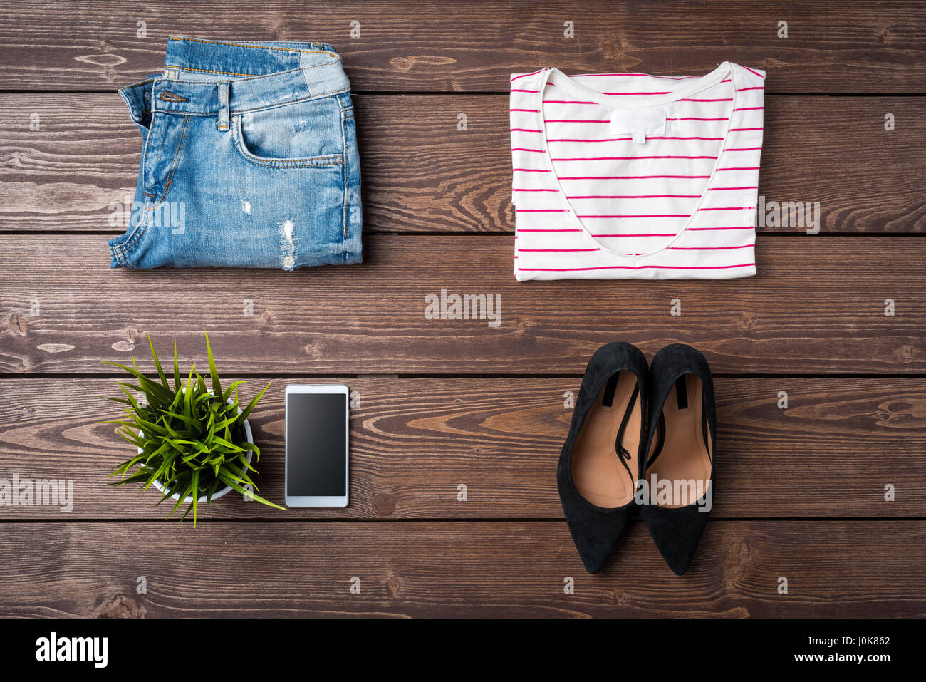 Female clothes on wooden table Stock Photo - Alamy