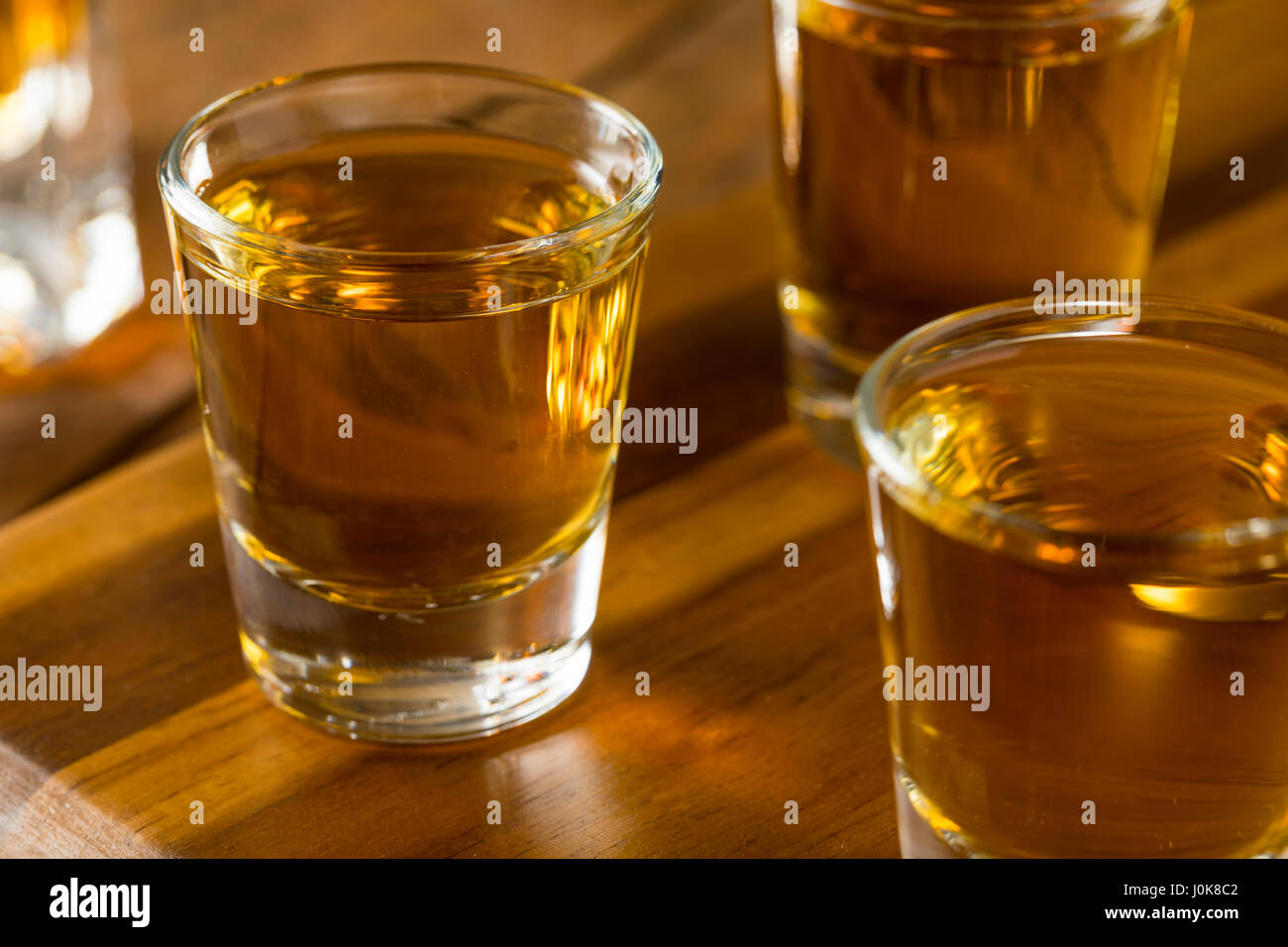 Group of Bourbon Whiskey Shots Ready to Drink Stock Photo - Alamy