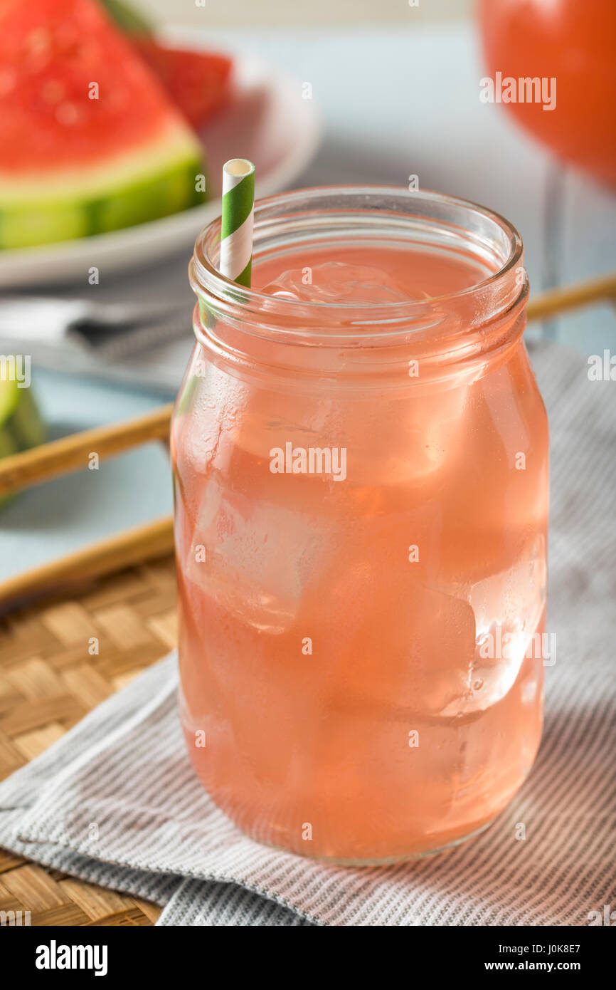 Refreshing Cold Watermelon Juice with Ice and a Straw Stock Photo - Alamy