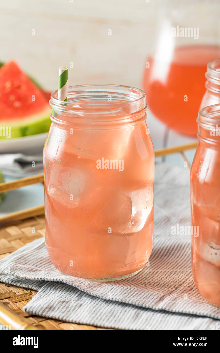 Refreshing Cold Watermelon Juice with Ice and a Straw Stock Photo - Alamy