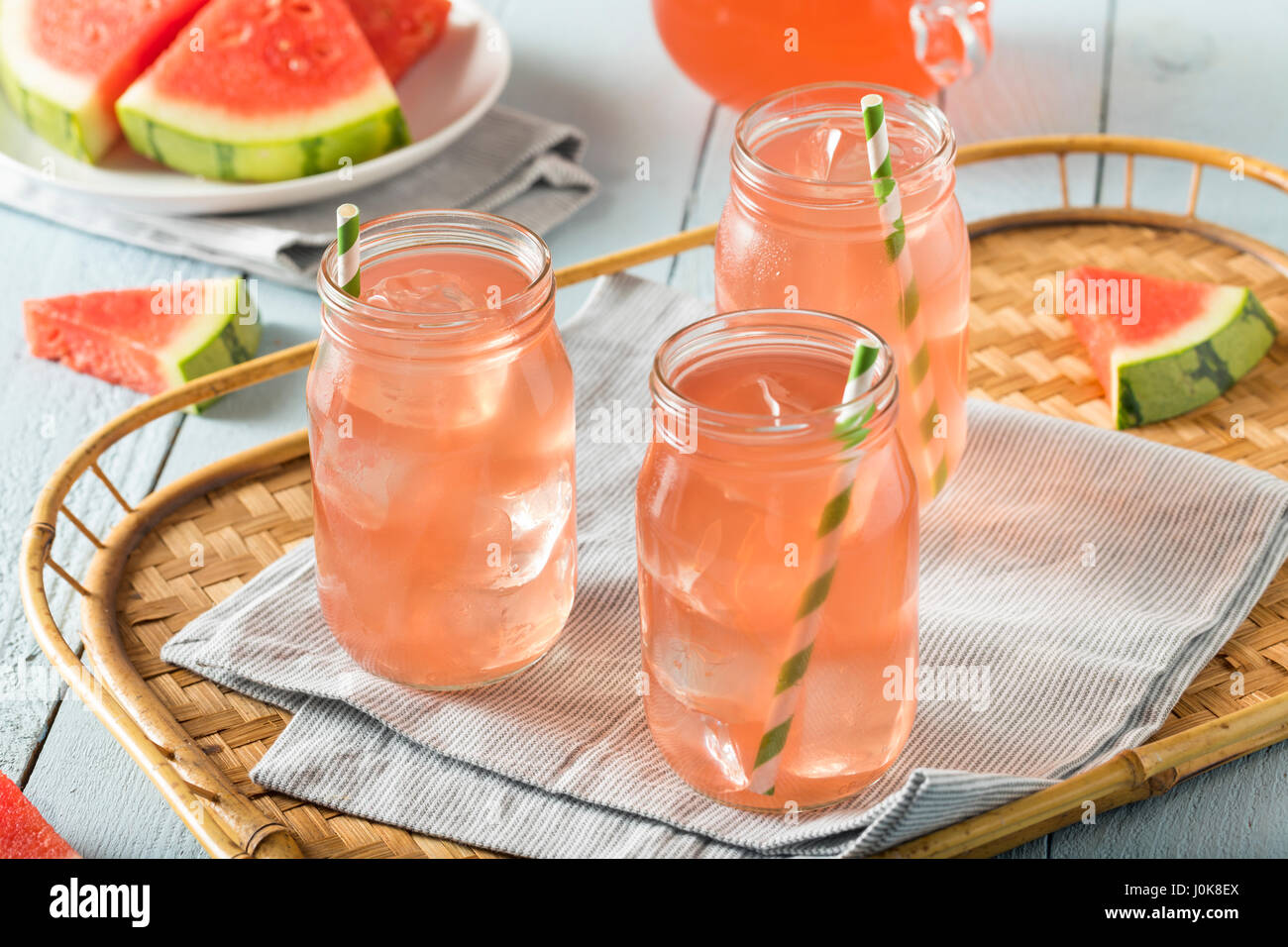 Refreshing Cold Watermelon Juice with Ice and a Straw Stock Photo - Alamy