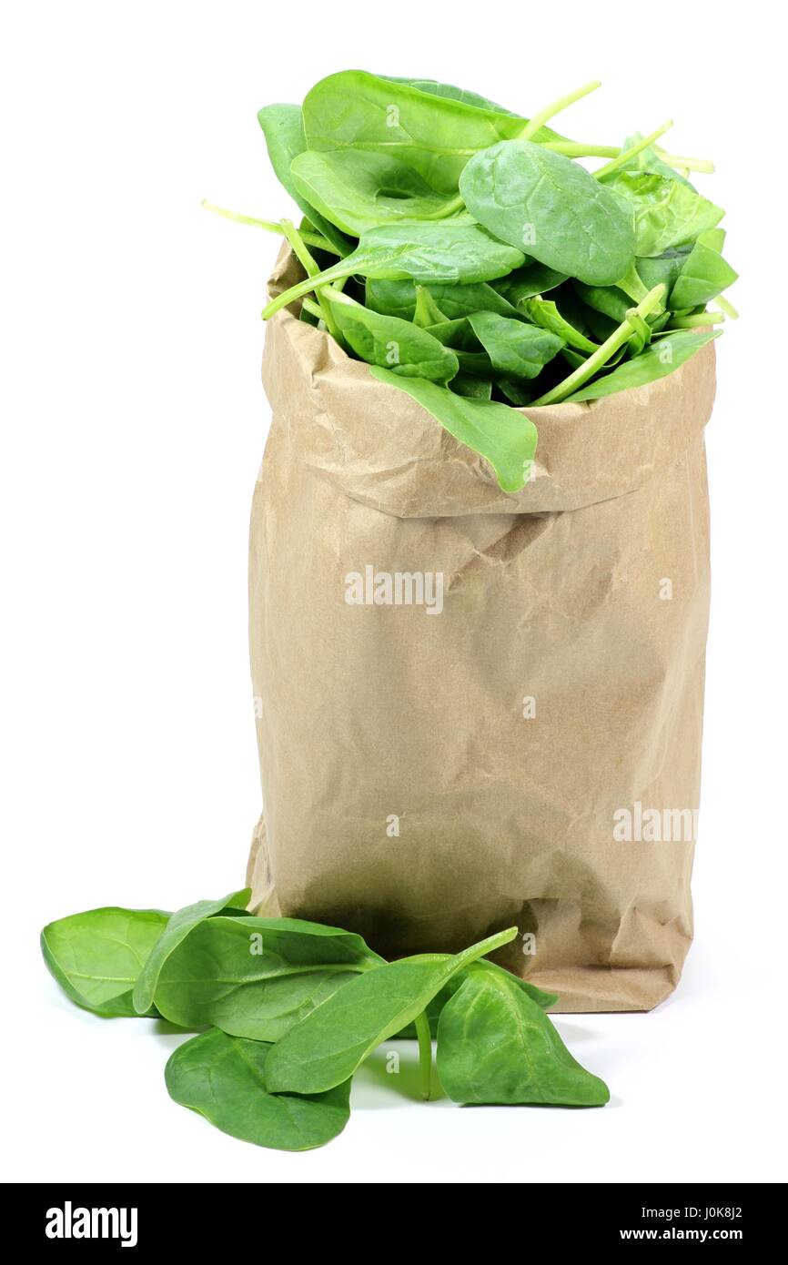 fresh spinach in a paper bag isolated on white background Stock Photo ...