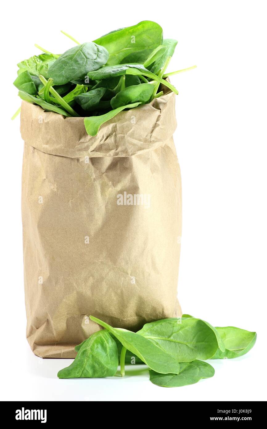 fresh spinach in a paper bag isolated on white background Stock Photo ...